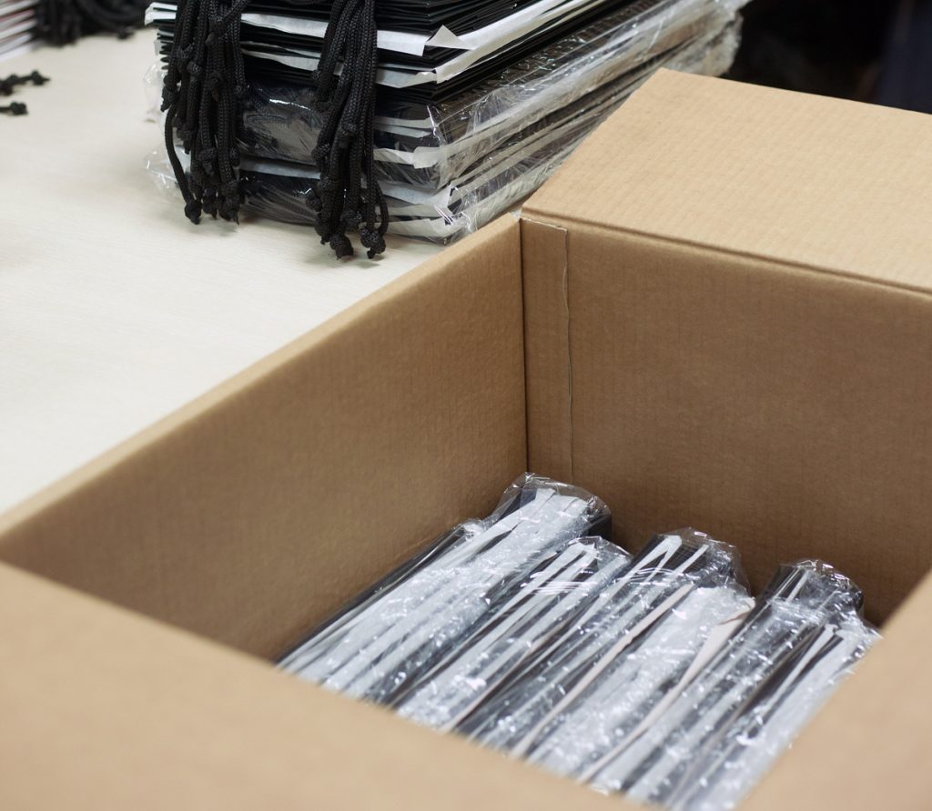 Packing of custom-made bags and boxes for safe delivery